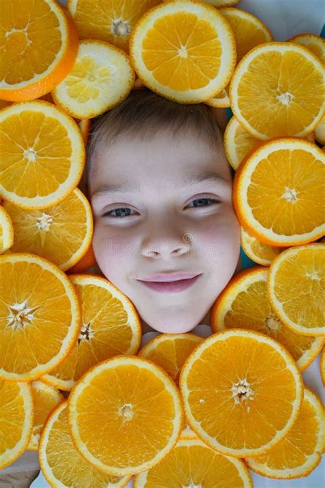 Close Up Male Model Face In The Middle Sliced Oranges Portrait Of