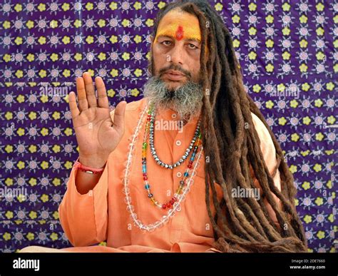 Indian Hindu Sadhu Baba Guru With Extremely Long Dreadlocks Raises
