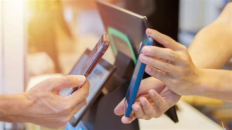 Premium Photo Close Up Man Uses Mobile Phone To Scan Qr Code For Payment