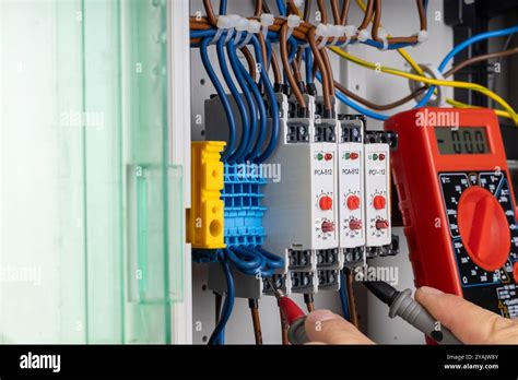 Electrician Testing Circuit Connections With Multimeter Stock Photo Alamy