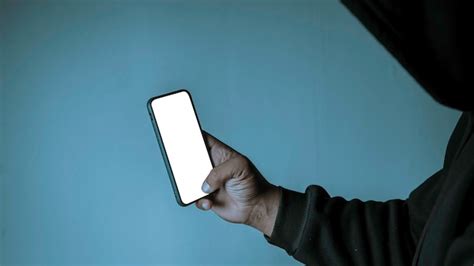 Premium Photo Closeup An Anonymous Hacker Wearing A Mask And A Black Hoodie Shows Off A