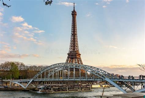 Eiffel Tower And Debilly Bridge Over Seine River At Sunset Paris