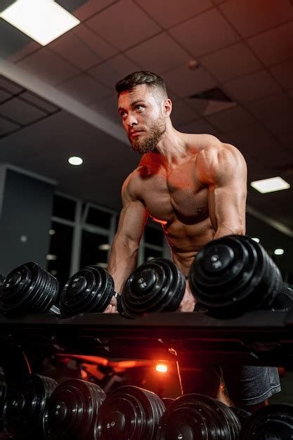 Premium Photo Strong Muscular Man Working Out In The Gym Athletic