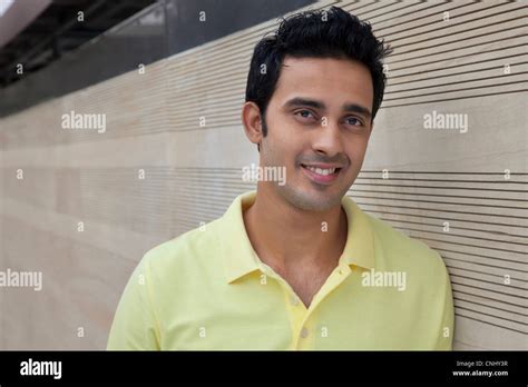 Man Leaning Against A Wall Stock Photo Alamy