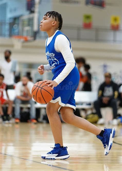 Black Young Boy Holding And Ready To Pass The Ball Editorial Stock