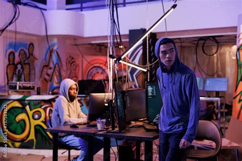 Suspicious Hacker Looking Away After Breaking Into Server And Doing Illegal Activity Young