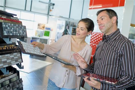 Happy Couple Of Adults Choosing Ceramic Tile For Bathroom Photo Background And Picture For Free