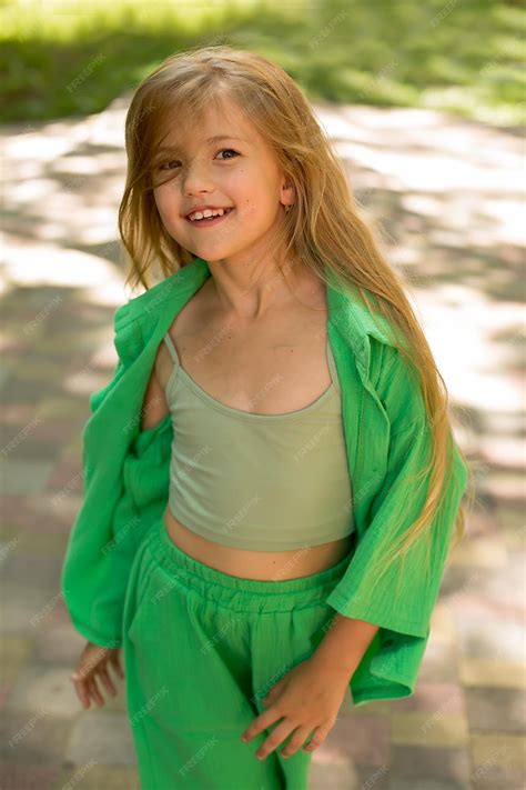 Premium Photo Beautiful Beautiful Longhaired Blonde Girl In A Green