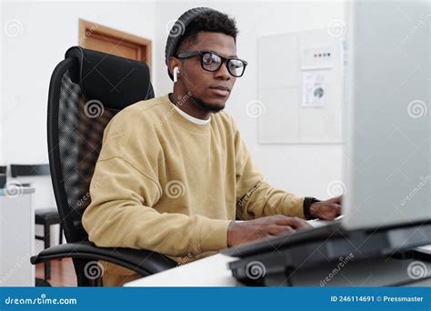 Young Contemporary Serious Male It Programmer Looking At Computer Screen Stock Image Image Of