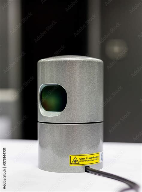 A Rotating Lidar Sensor With Cable On A Bench Prior To Installation In