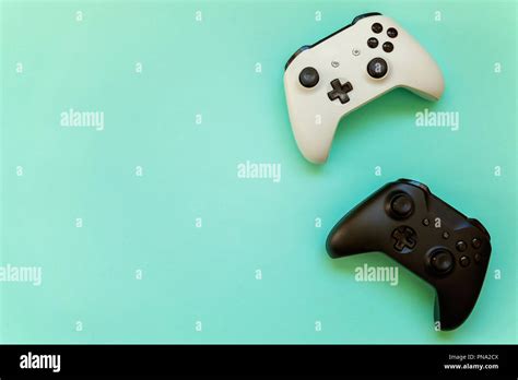 White And Black Two Joystick Gamepad Game Console On Blue Colourful Trendy Modern Fashion Pin