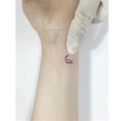Pin By Elizabeth Robles On Cacq Dinosaur Tattoos Tiny Tattoos Planet Tattoos