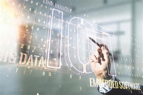 Premium Photo Man Hand With Pen Working With Abstract Virtual Iot Hologram On Blurred Office