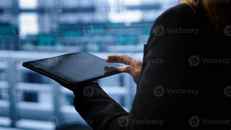 System Administrator Monitoring Server Room Doing Checkup Inputting