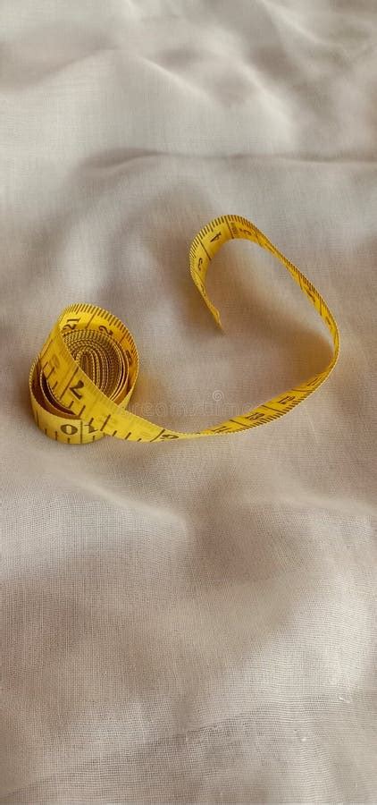 Yellow Sewing Measuring Tool For Measuring Clothes And Fabrics Stock