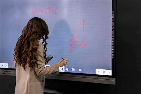 Math Teacher In The School Writing New Exam Task On The Digital