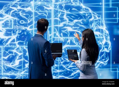 Team Of Admins Using Tablet And Laptop To Do Maintenance On Artificial