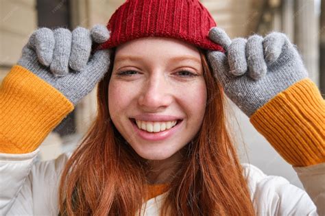 Free Photo Headshot Of Happy Redhead Girl With Freckles Wears Red Hat