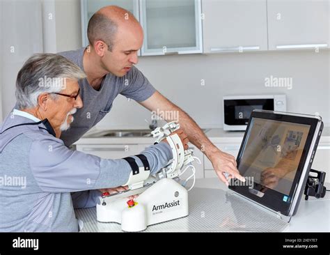 patient with assistive robot for upper limb rehabilitation the robot