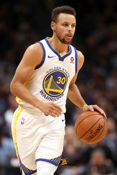 Stephen Curry Of The Golden State Warriors Brings The Ball Down The