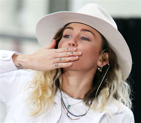 Miley Cyrus Tattoos Guide To All Her Ink And Their Meanings