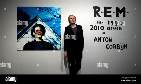 Photographer And Director Anton Corbijn Stands Next To His Photography