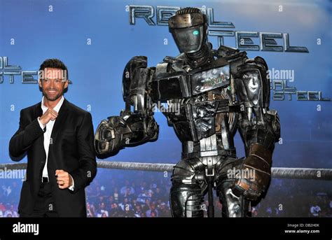 Australian Actor Hugh Jackman Poses With The Robot Atom During A