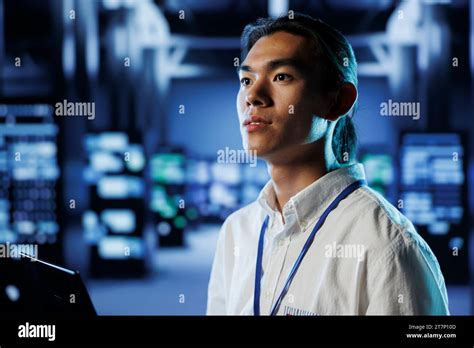 Certified Technician In Data Center Uses Laptop To Prevent System
