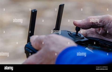 Close Up Of An Old Man With His Finger On The Joystick Operating A Close Up Of An Old Man With His Finger On The Joystick Operating A