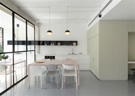 Thin Black Frames Draw The Eye Around A Renovated Tel Aviv Apartment