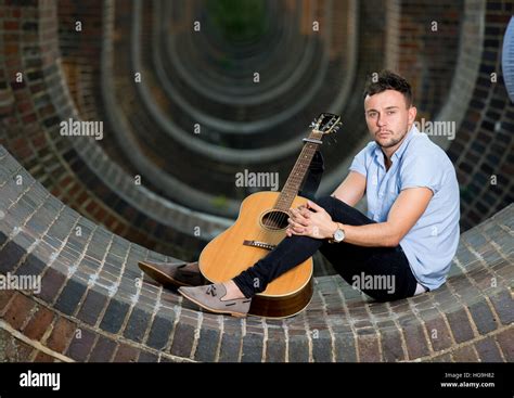 Singer Songwriter Jamie Mathias Poses With His Guitar For A Shoot At The Ouse Valley Viaduct