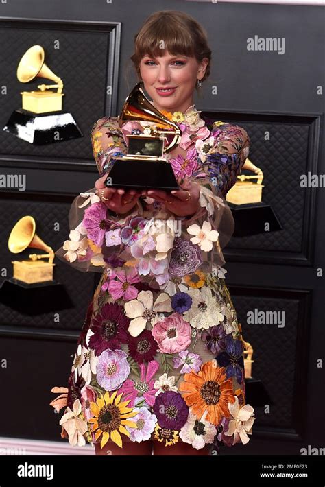 Taylor Swift Poses In The Press Room With The Award For Album Of The