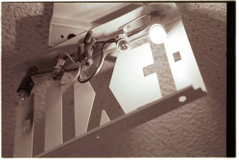 Vintage Metal Light Fixture Illuminating Reflective Surface Free Stock