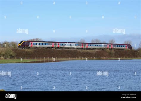 Class 220 Voyager Diesel Electric Passenger Train Passing Flooded Land