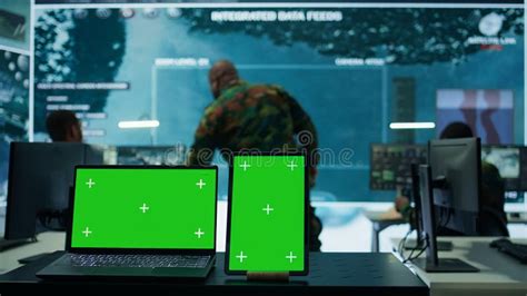 Laptop With Green Screen Display Running In Military Base Of Operations
