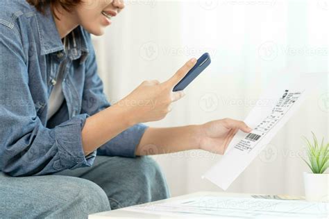 Young Woman Use Phone To Scan Barcode Or Qr Codes To Pay Credit Card