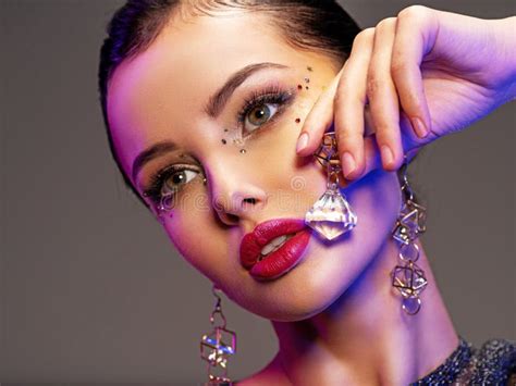 Portrait Of Beautiful Young Woman With Bright Makeup Shiny Sequins On