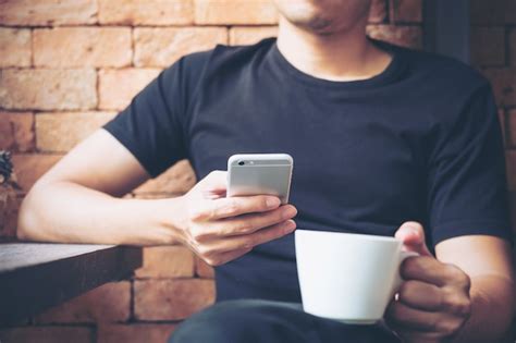 Premium Photo Man Holding Smart Phone