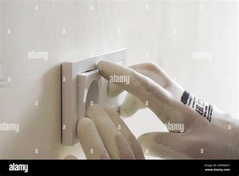 Installation Of Electric Household Socket On The Wall During The Renovation Of The Apartment