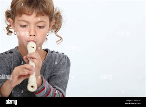 Girl Playing A Recorder Stock Photo Alamy