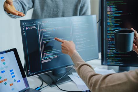 Asian And Indian Developer Team Discussion Feedback Analysis Coding Data With Software Computer