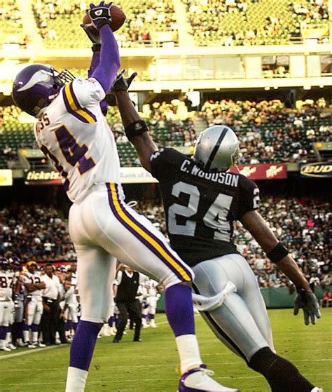 Randy Moss Going Up Over Charles Woodson Minnesota Vikings Nfl
