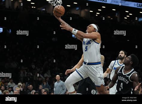 Orlando Magics Paolo Banchero 5 Drives Past Brooklyn Nets Drake Powell 4 During The Second