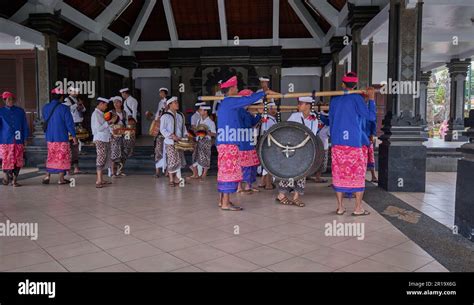 Local Balinese People Performing Their Prayers In Pura Ulun Danu