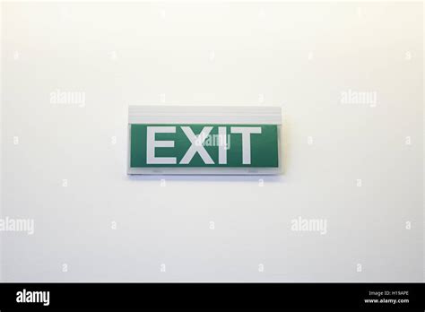Exit Sign On White Wall Symbol Stock Photo Alamy