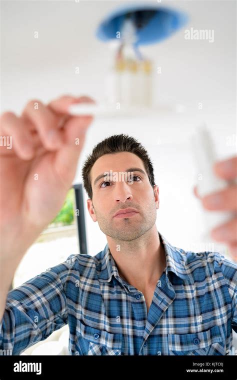 Electrician Changing A Bulb Stock Photo Alamy