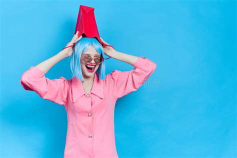 Cheerful Glamorous Woman With Glasses Posing In Red Package Stock Image