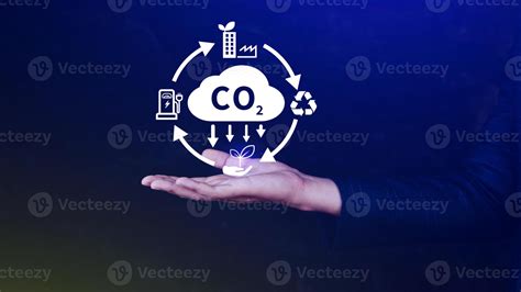 Hand Holding Co2 Reducing Virtual Icon For Decrease Carbon Dioxide