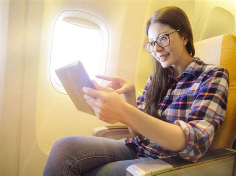 Premium Photo Sweet Beauty Woman Passenger Looking At Mobile Pad