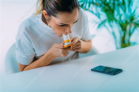 Woman Using Spirometer Stock Image F027 7003 Science Photo Library